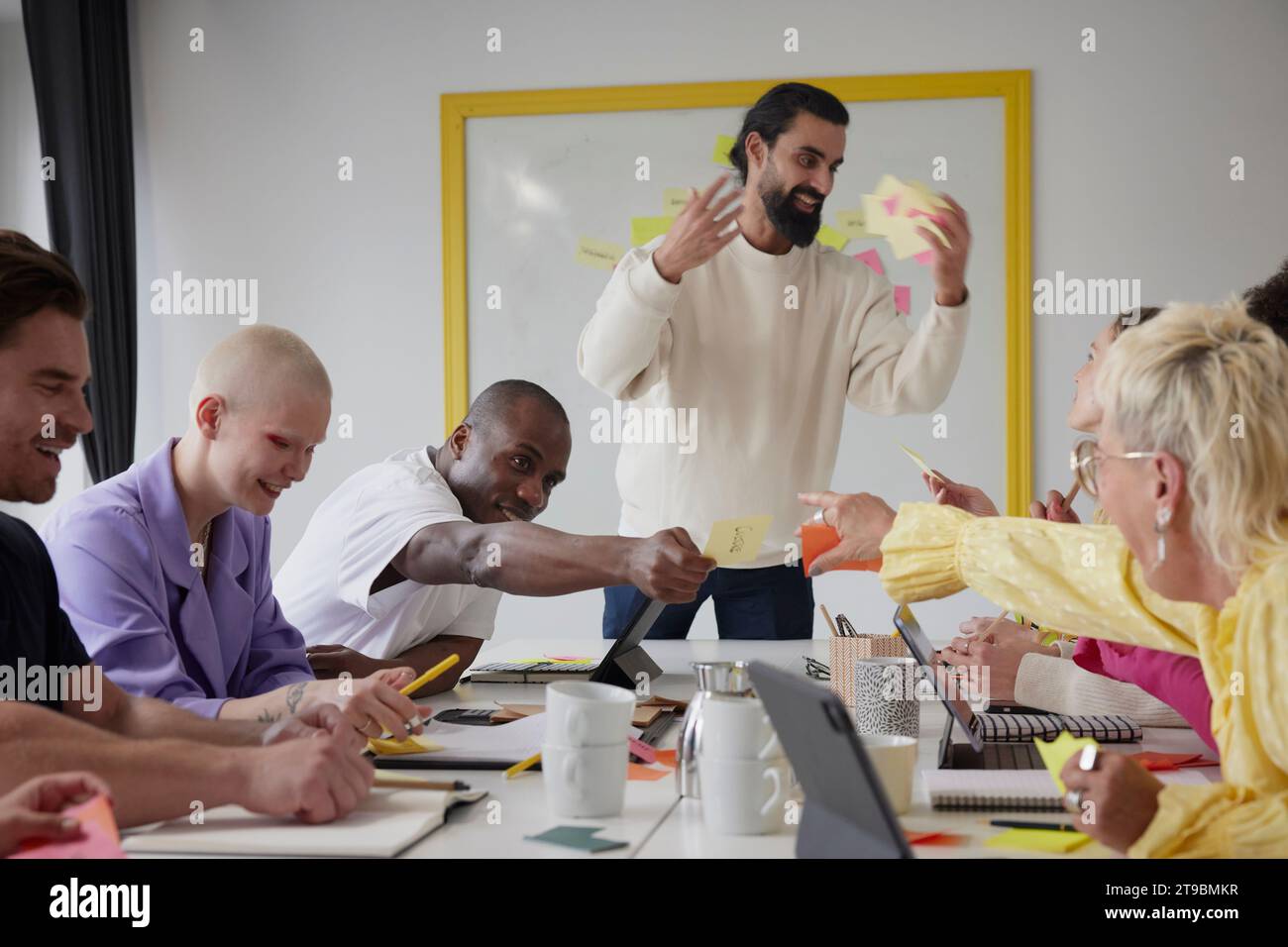 Diverse team brainstorming during business meeting in conference room ...