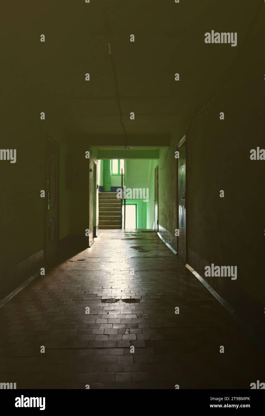 The gloomy corridor of a neglected public building. Public space in a ...