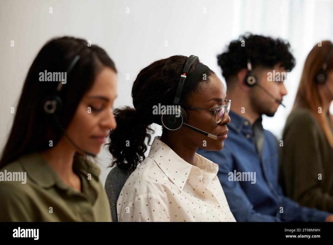 Diverse call center employees at work Stock Photo - Alamy
