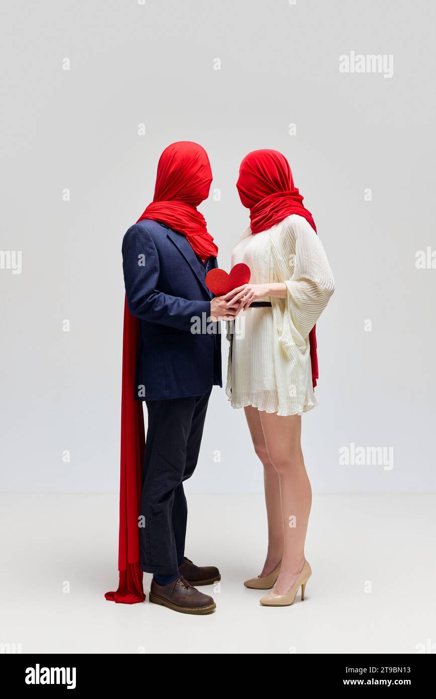 Exaggerated feelings. Unrecognizable couple, man and woman with fabric ...