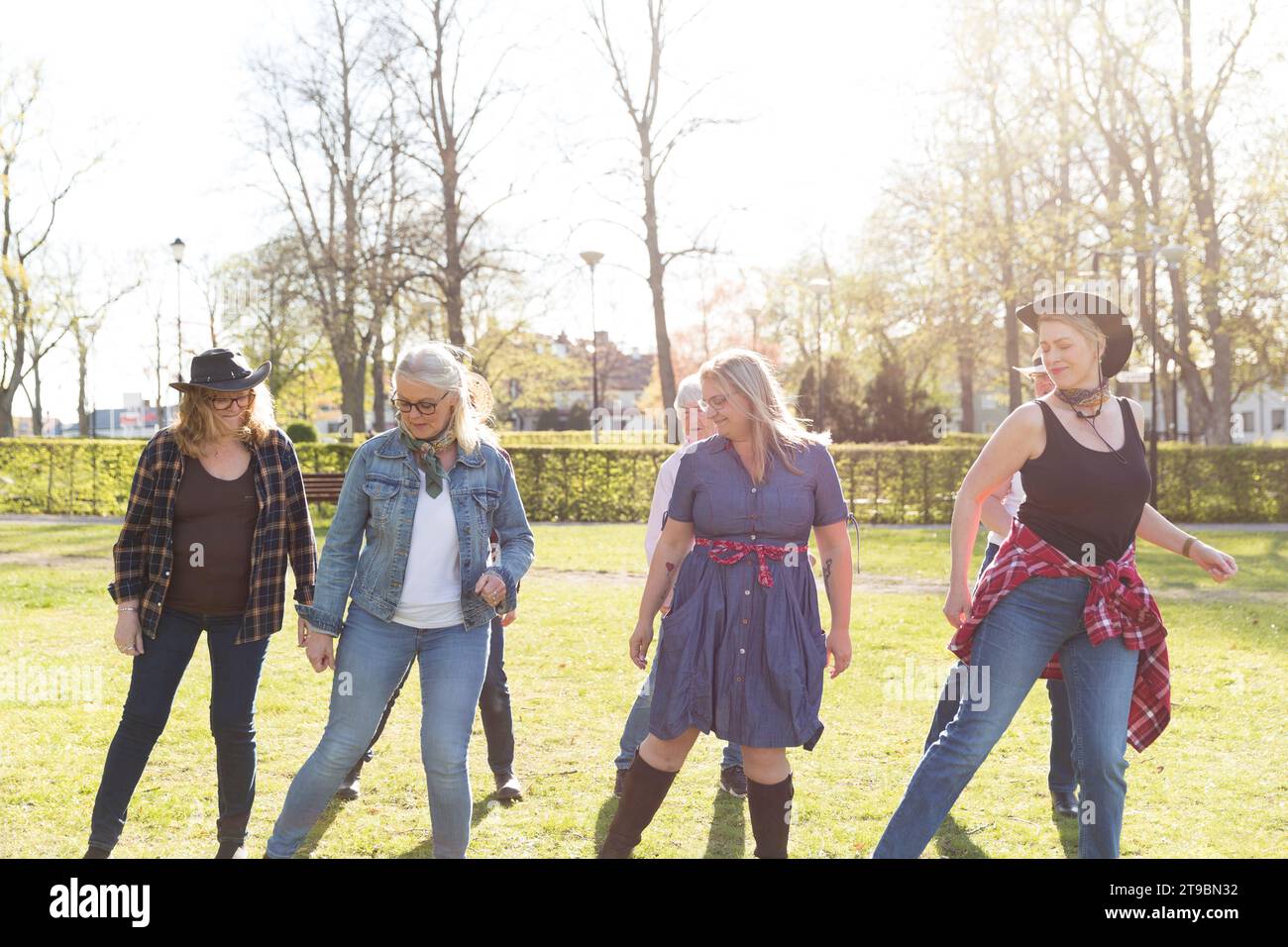 View of women dancing in autumn park Stock Photo - Alamy
