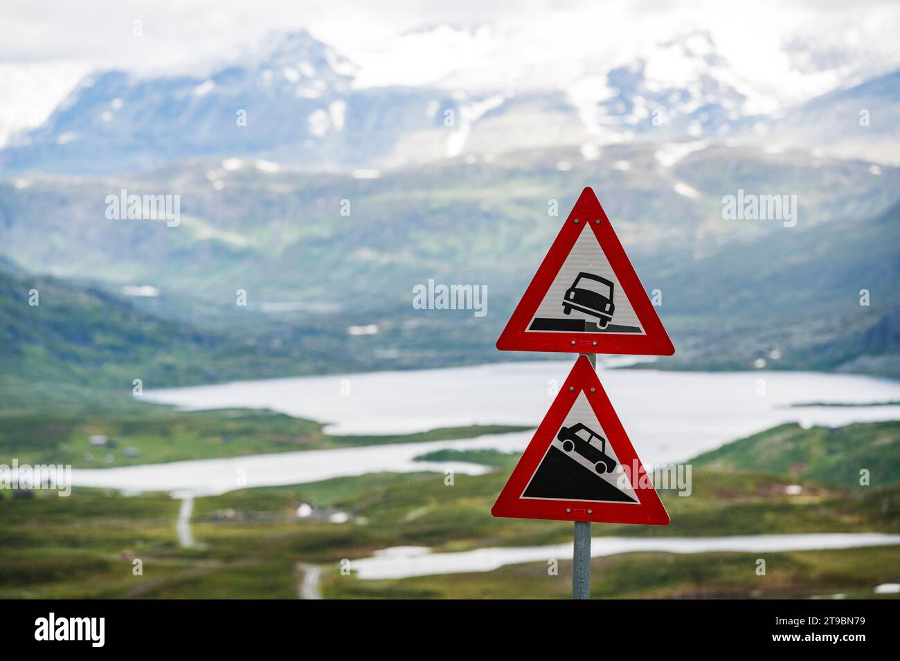 Warning road signs in mountains Stock Photo - Alamy
