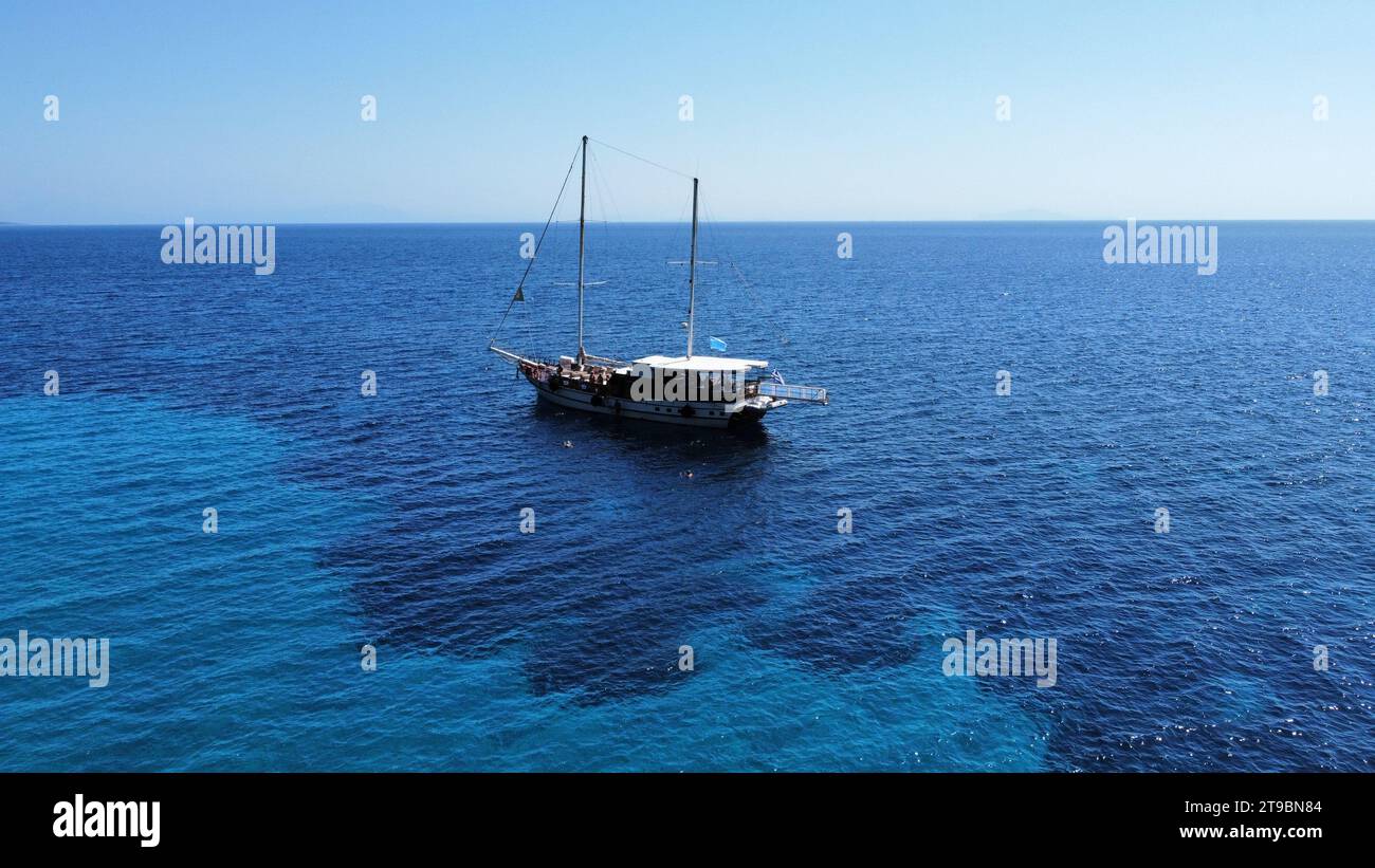 Sailing boat and catamaran in Greece; Crystal water, beautiful colors ...