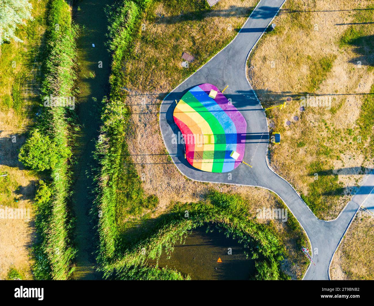 Rainbow painted on pavement at playground Stock Photo - Alamy