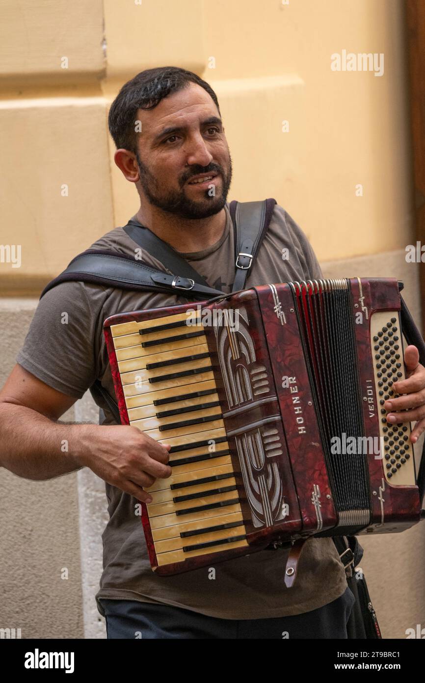 A street musician plays his 1930's vintage Hohner accordion in Sorrento ...