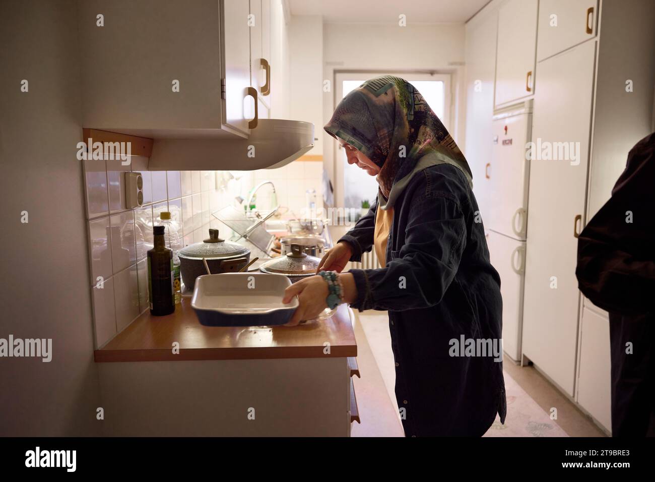Mature middle eastern woman cooking hi-res stock photography and images ...
