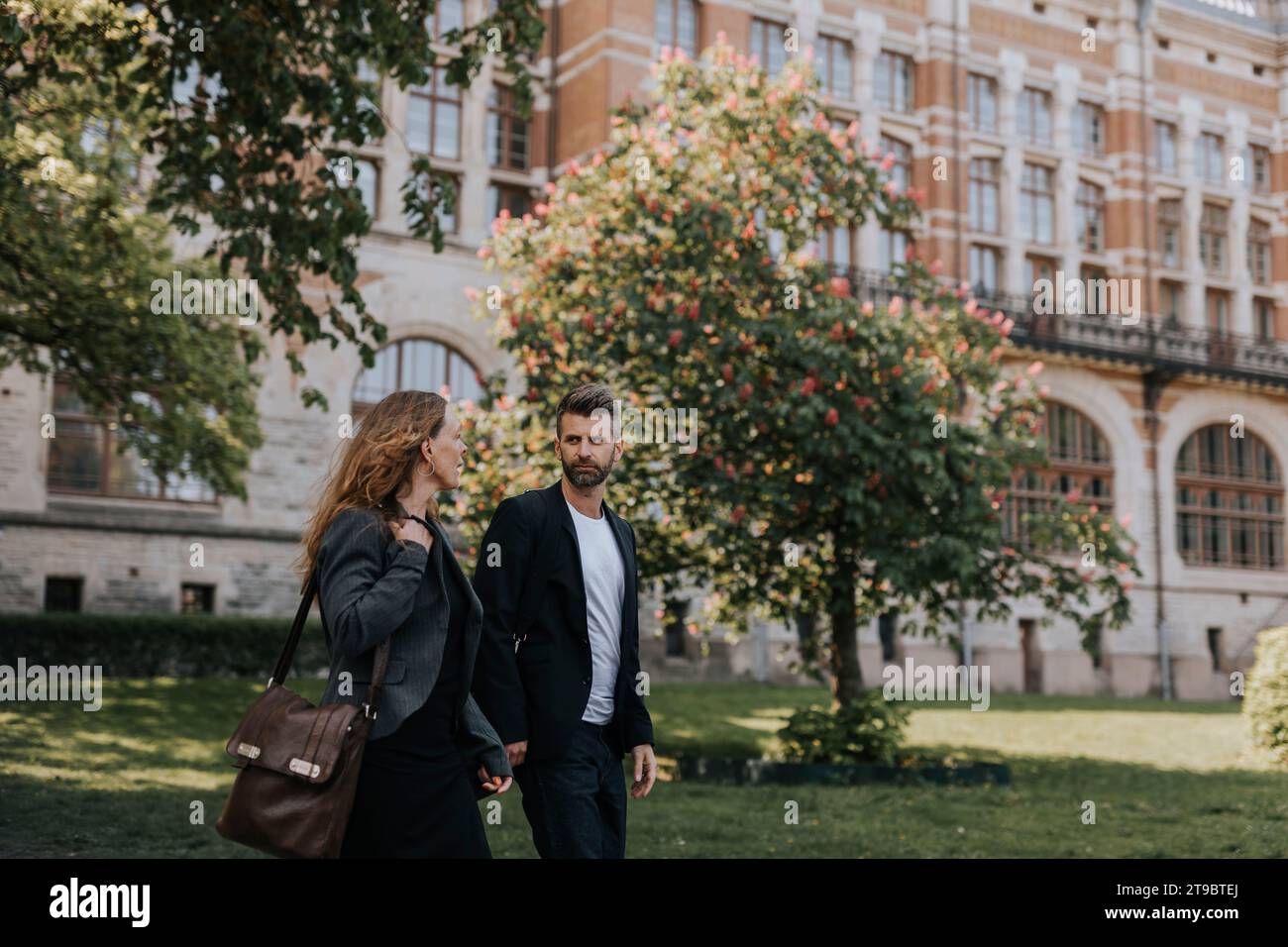 Female coworker walking in hi-res stock photography and images - Alamy