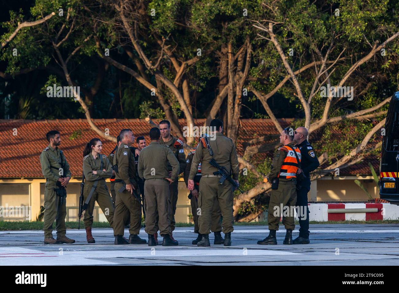 Petah Tikva, Israel. 24th Nov, 2023. Israeli military personal wait ...