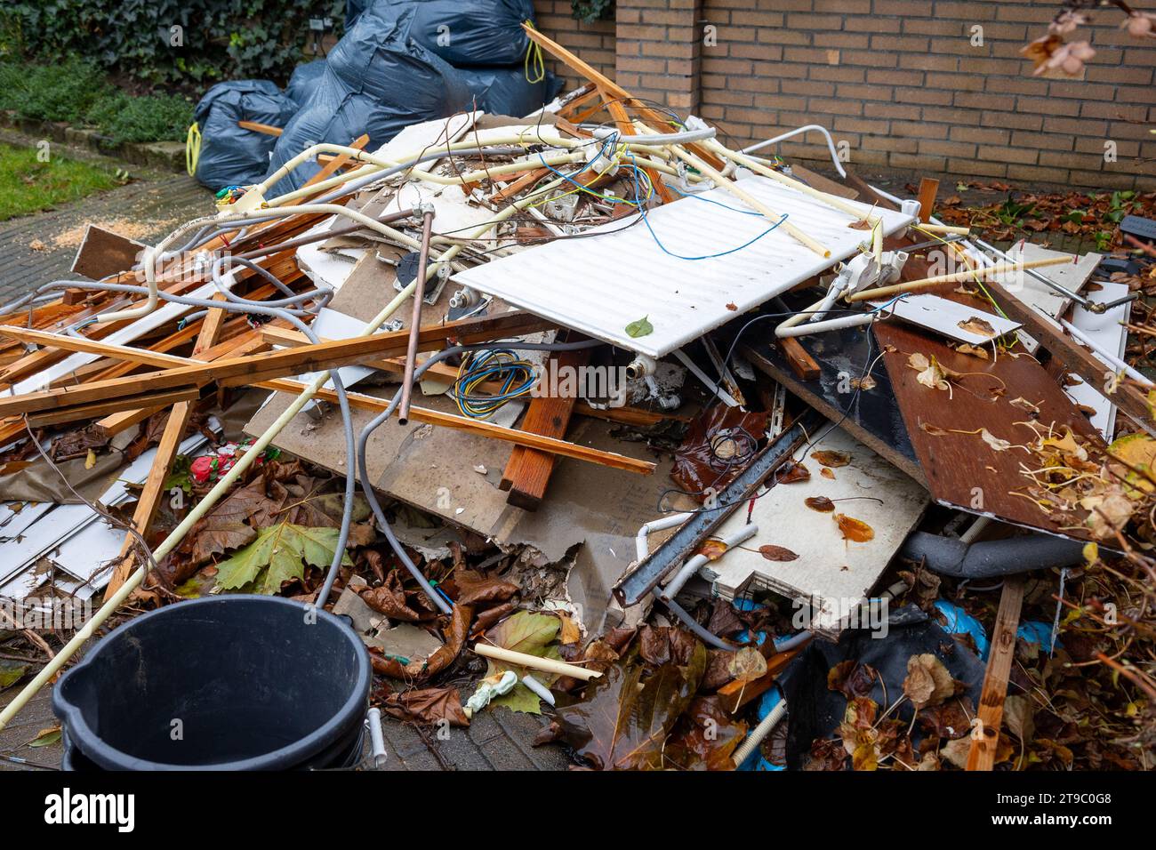 Construction waste piled up during a home renovation, with old heating ...