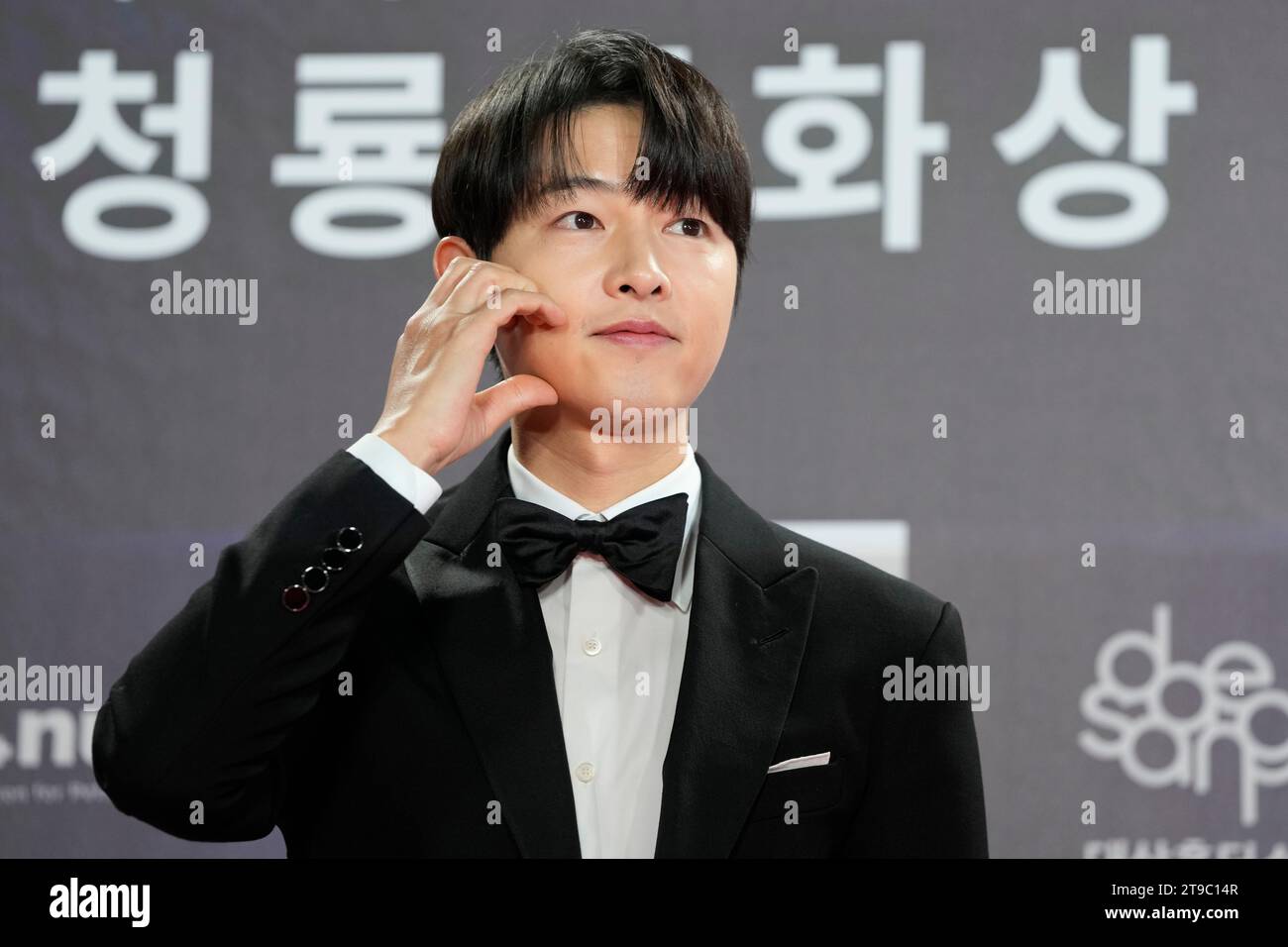 South Korean actor Song Joong-ki poses for photographers upon arrival ...