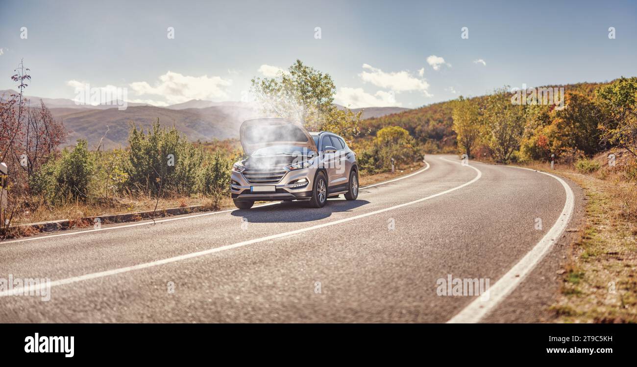 SUV on the road with an open hood, car breakdown concept Stock Photo ...