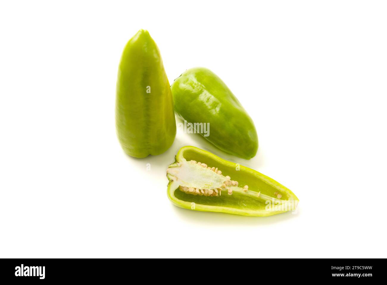 Two whole and half of green bell pepper (capsicum) known as sweet bell ...