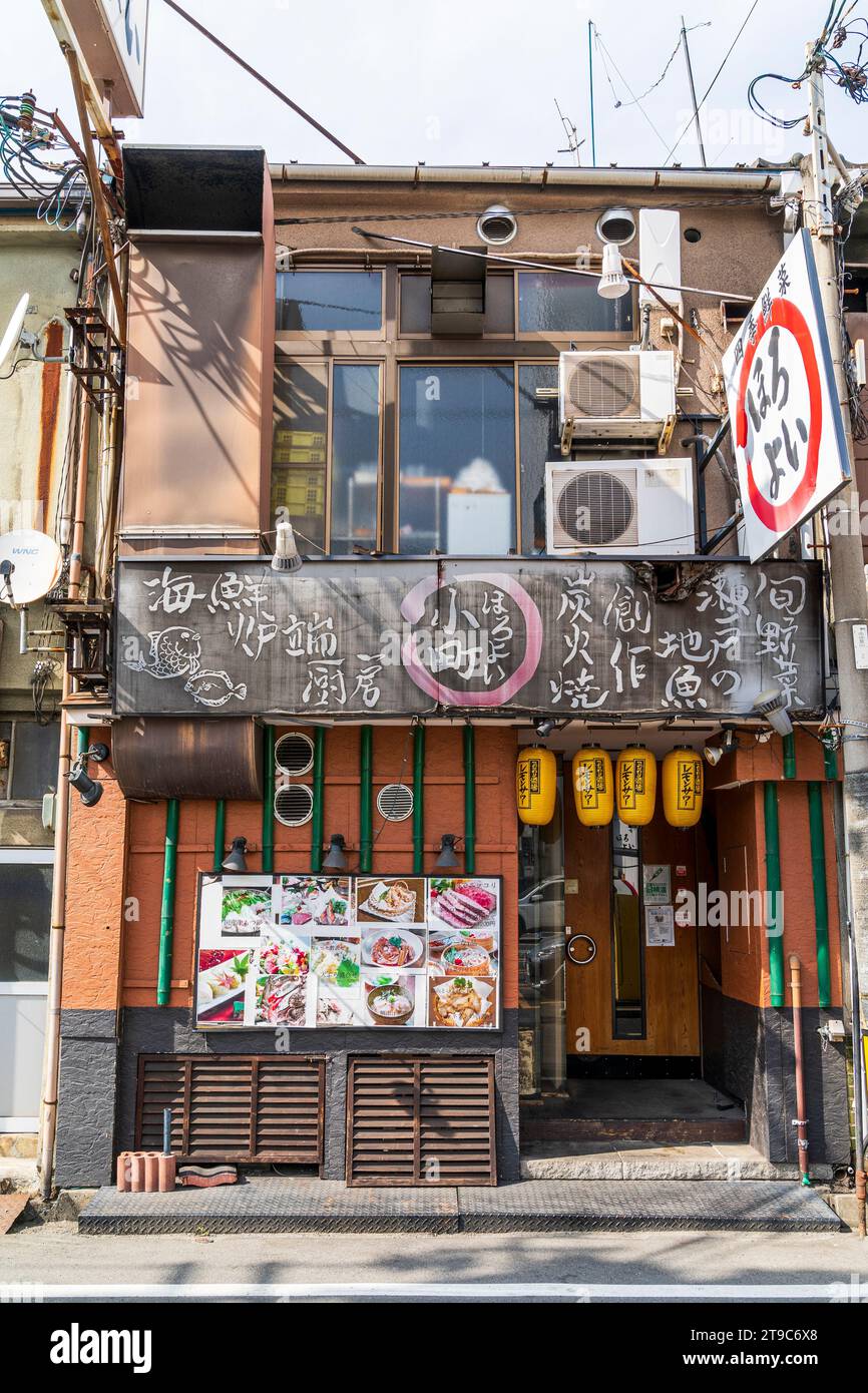 Exterior of typical small Japanese izakaya restaurant in Fukuyama ...