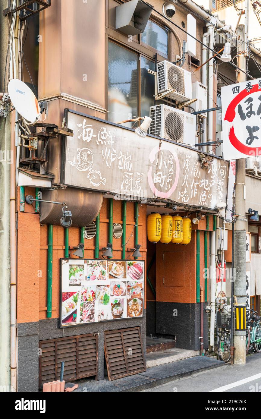 Exterior of typical small Japanese izakaya restaurant in Fukuyama ...