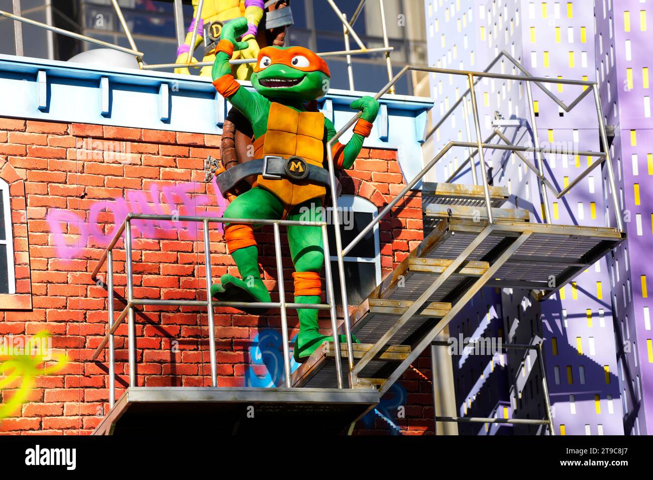 A Teenage Mutant Ninja Turtle rides a float in the Macy's Thanksgiving ...