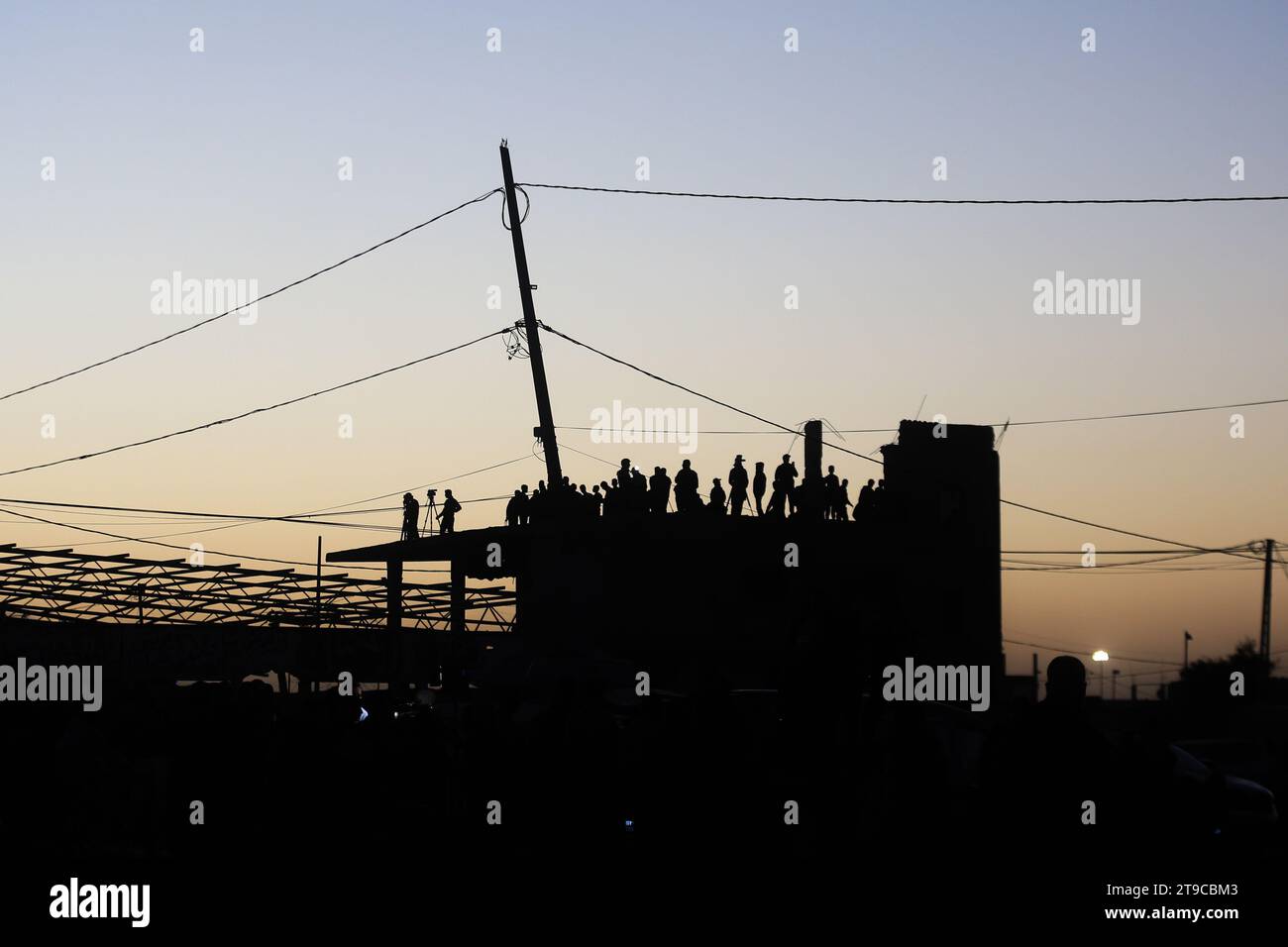 Rafah, Palestinian Territories. 24th Nov, 2023. Palestinians gather in ...