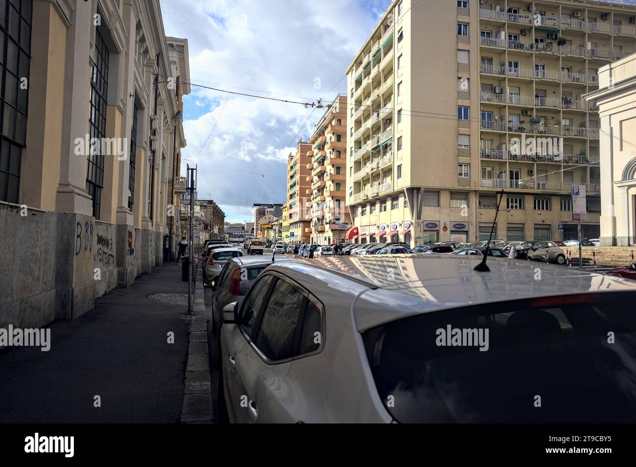 Genova, Italy - November 2023 - Street with parked cars by its edge ...