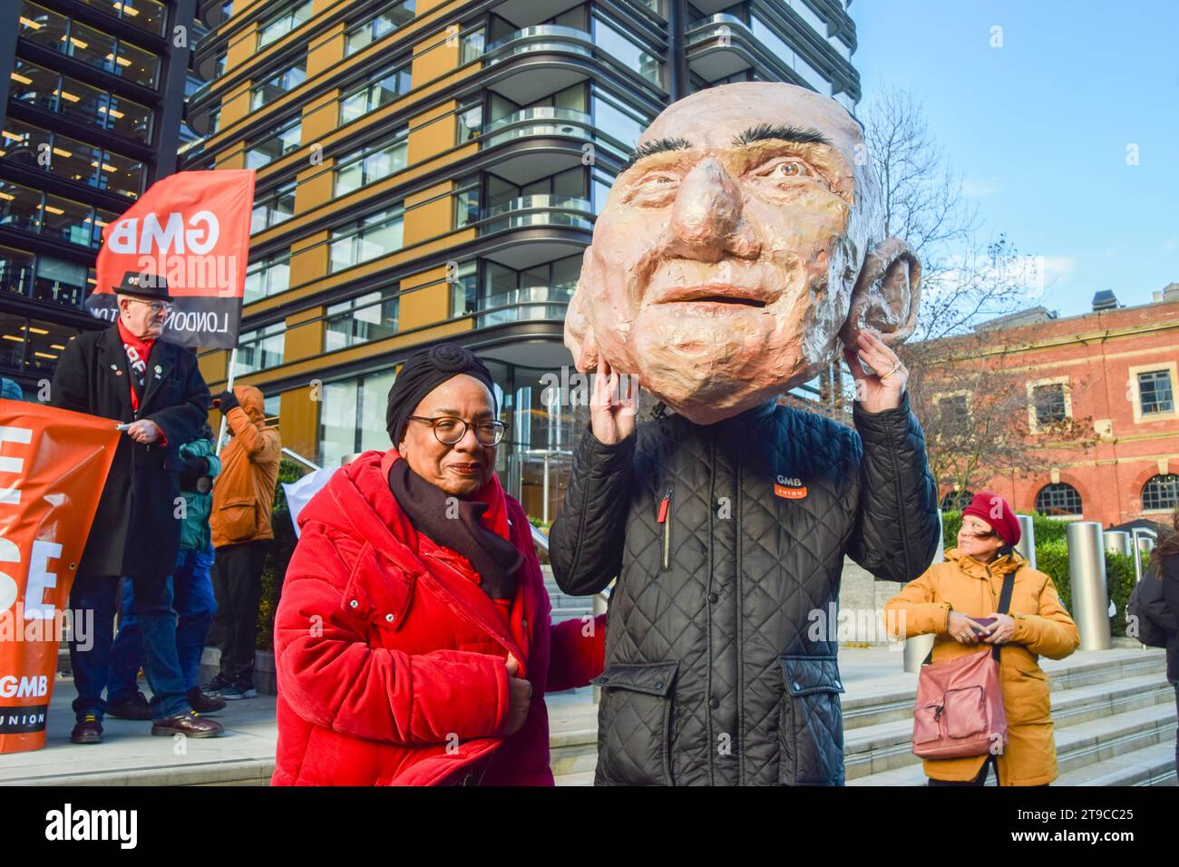 London, UK. 24th November 2023. MP Diane Abbott stands with a protester ...