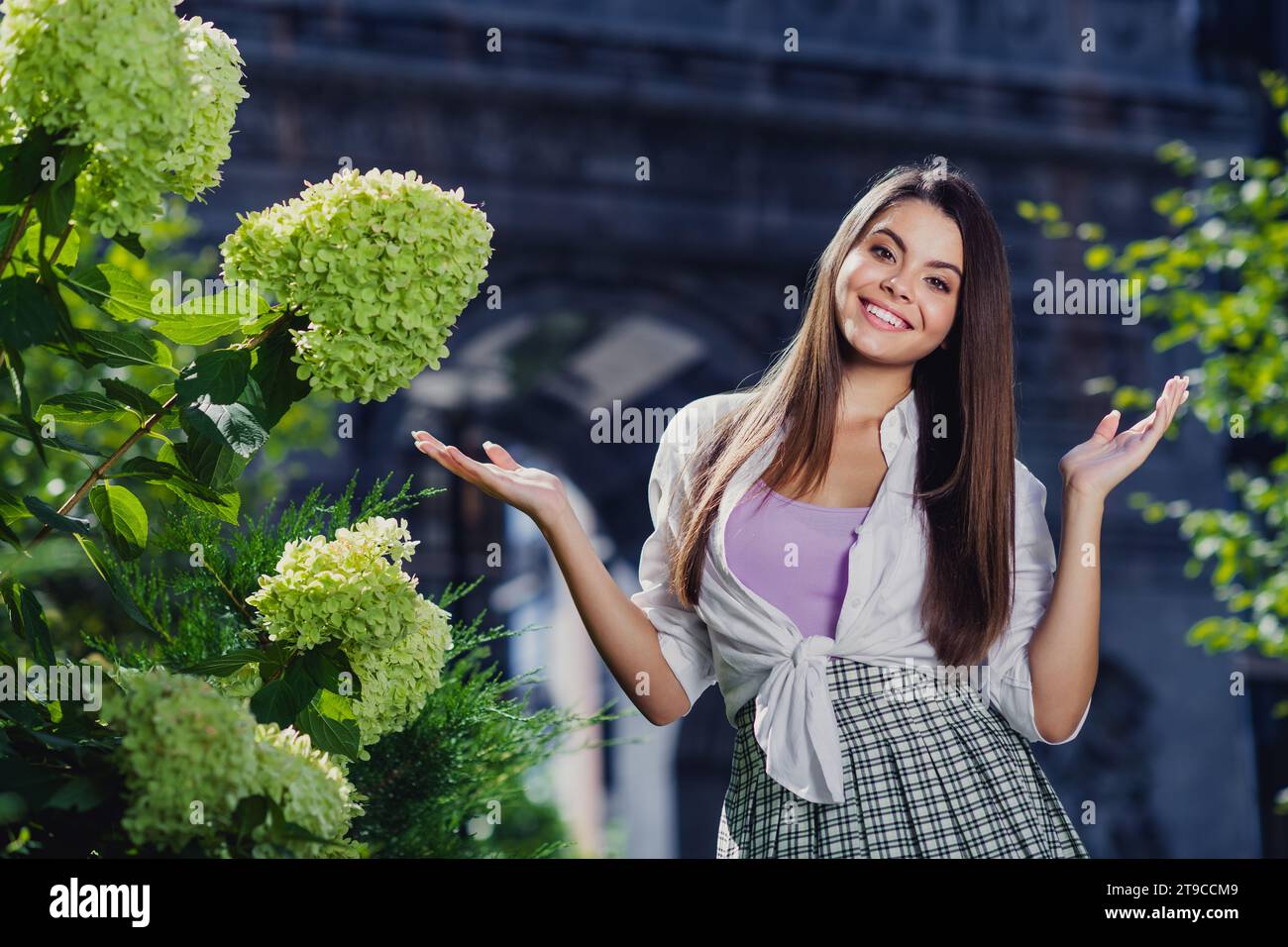 Portrait of excited lovely young lady toothy smile good mood raise hands talk fresh flourish ...