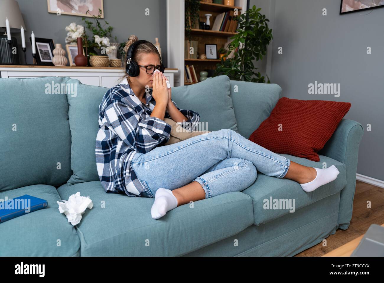 Sad tired young woman touching forehead having headache migraine or ...