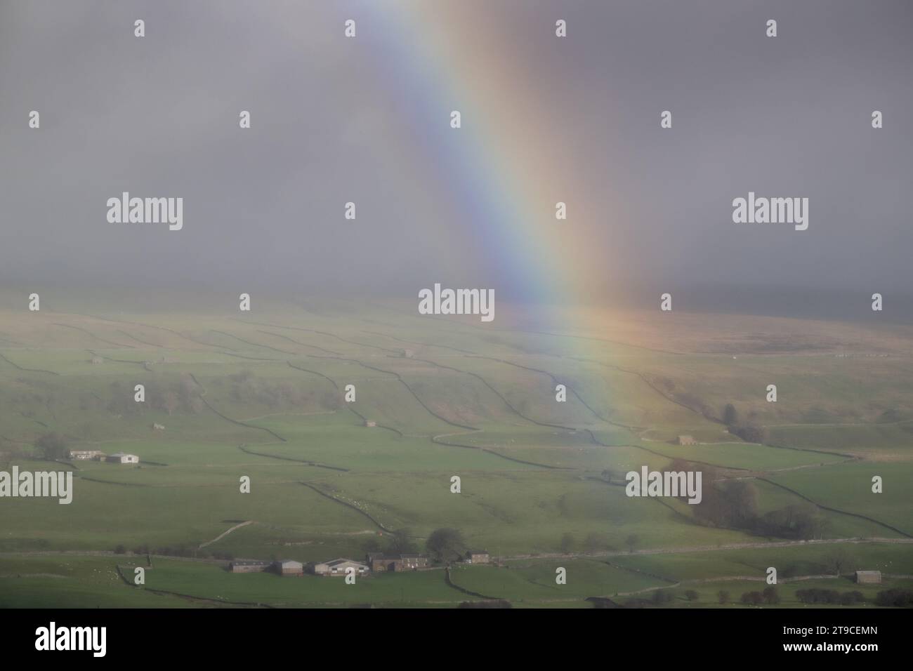 Rainbow over landscape on a stormy November morning in upper ...