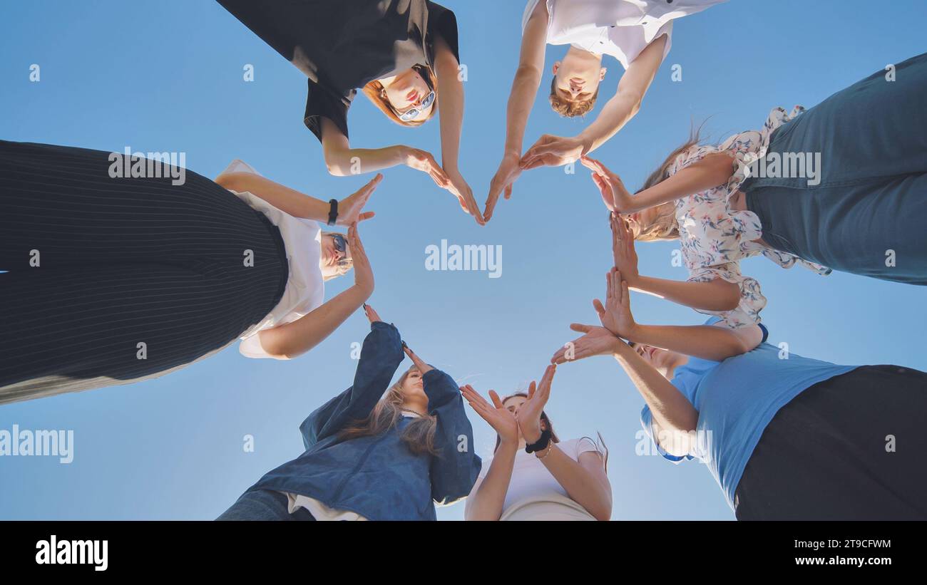School children make a heart shape from their hands Stock Photo - Alamy