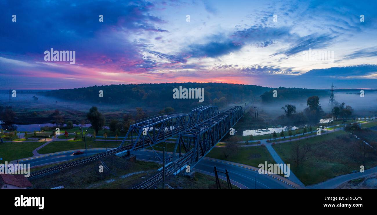 Riverside Awakening: Dual Railroad Bridges in the First Light Stock ...