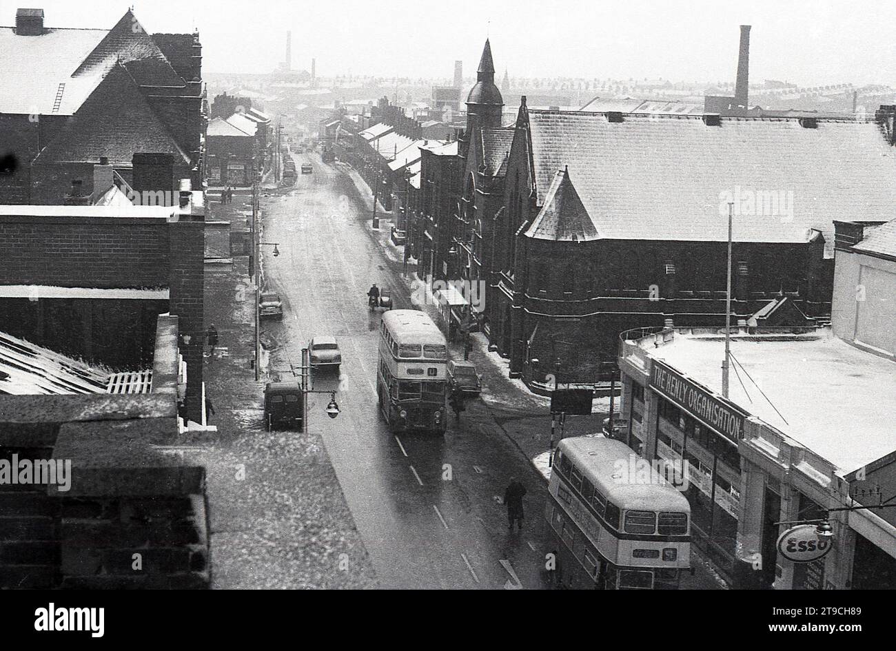 1960s, historical, wintertime and a view over a street in Oldham ...