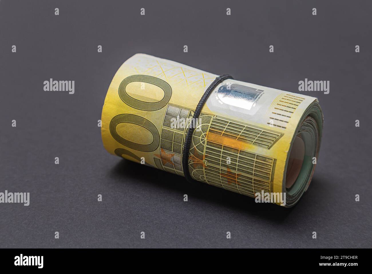 Roll of 200 euro banknotes on black background. Money concept Stock ...