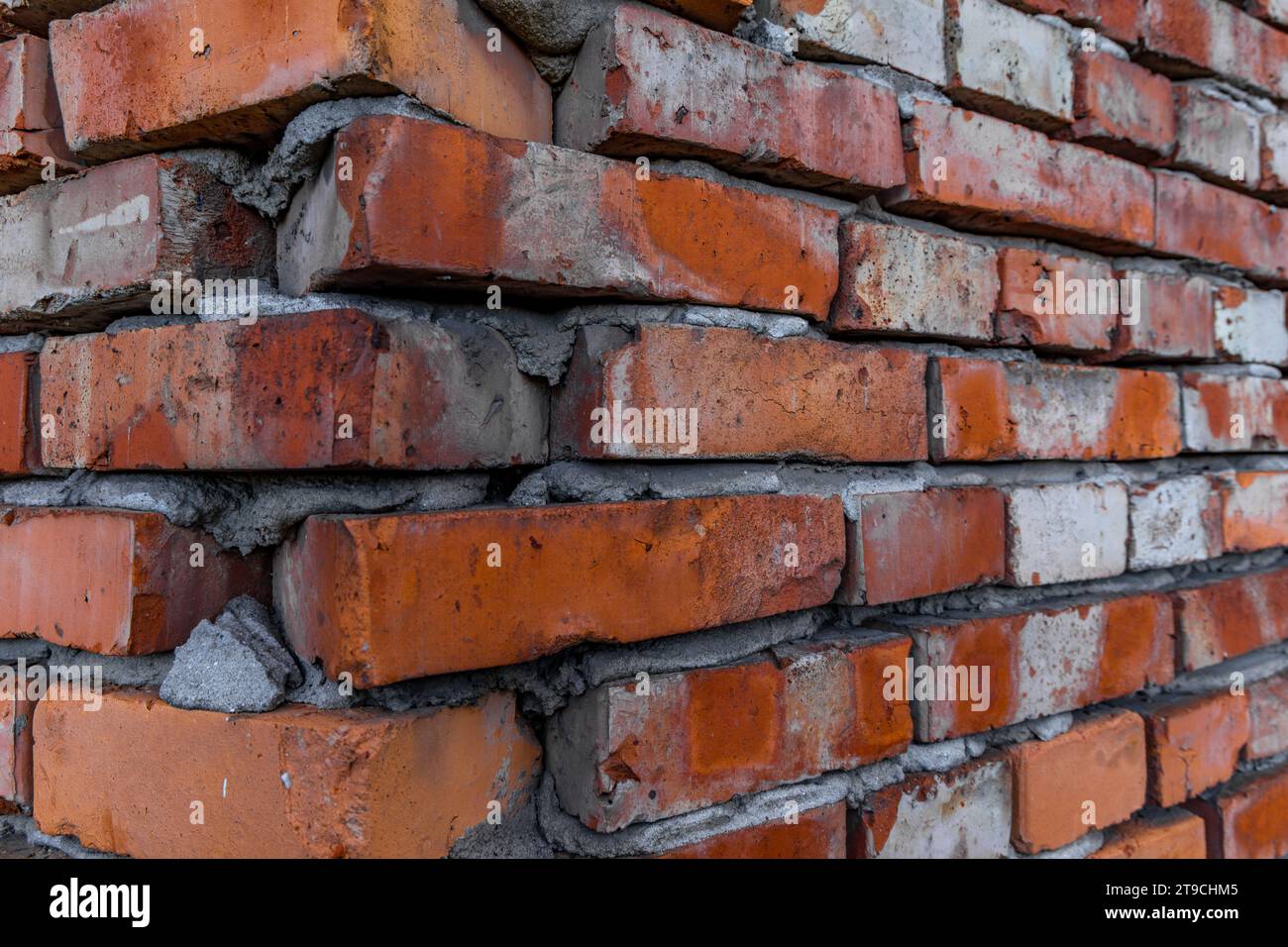 Red brick building scheduled for demolition, wrongly placed wall by the ...