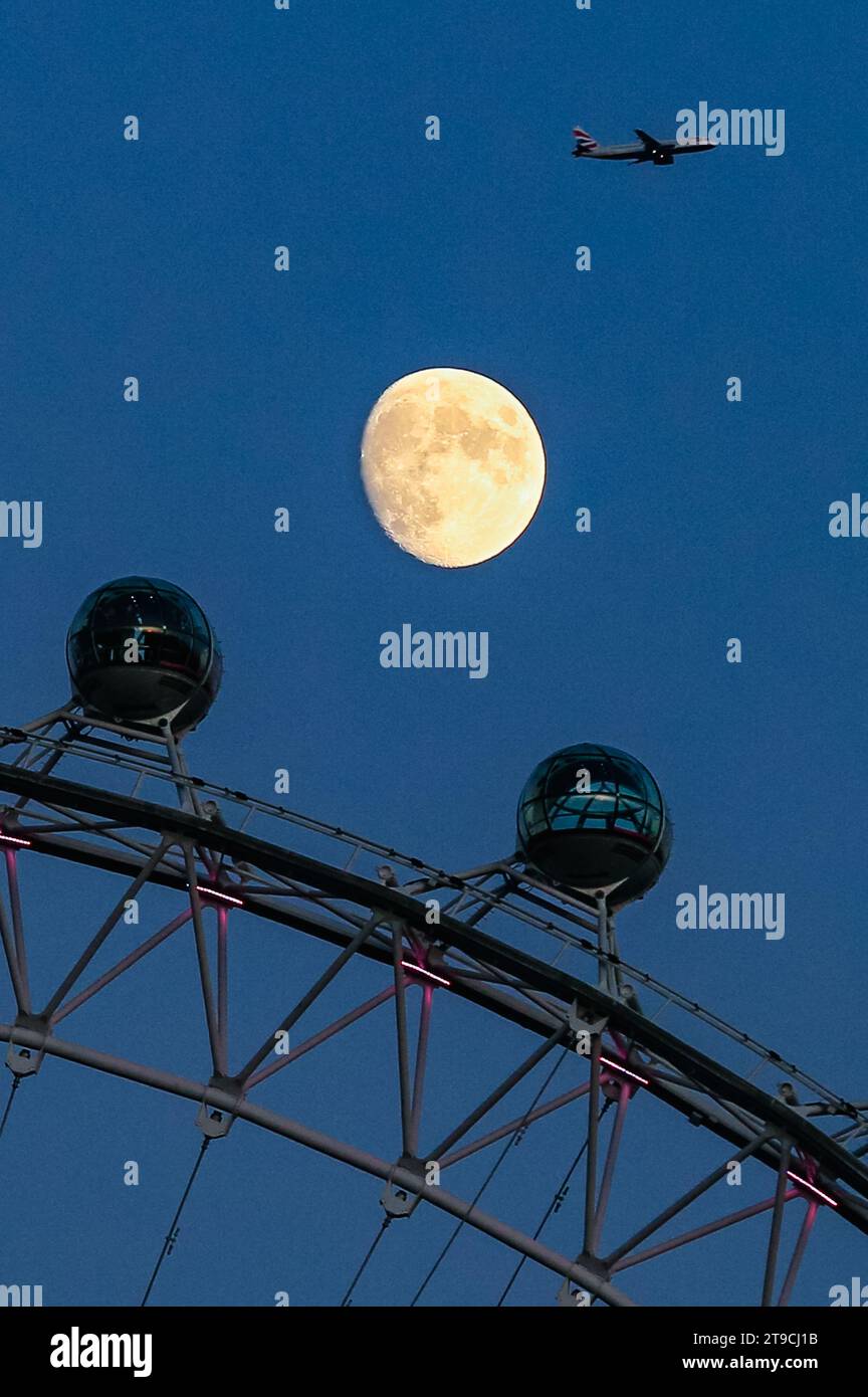 London, UK. 24th Nov, 2023. The Moon appears to dance atop capsules of ...