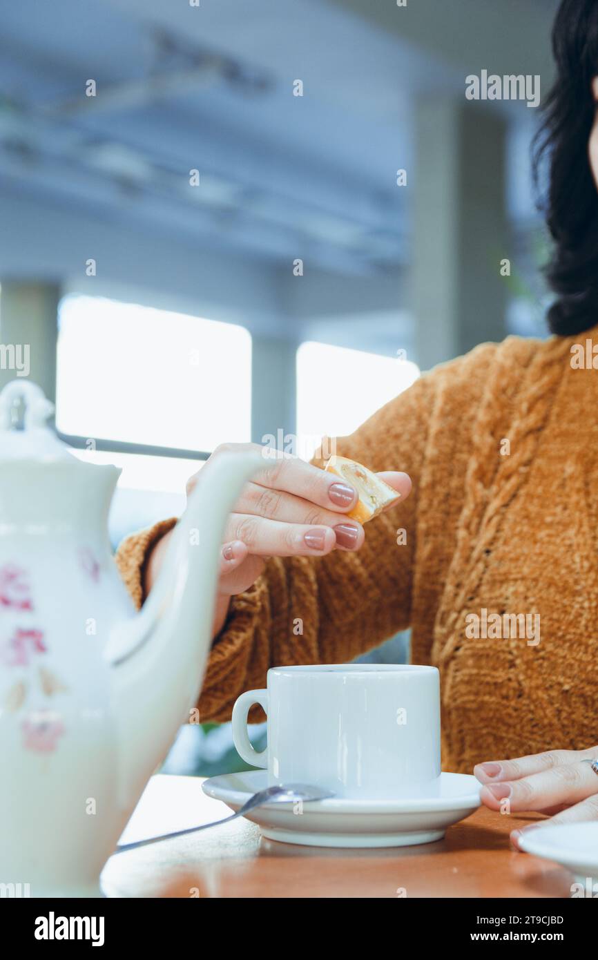 Female unrecognizable person drinking tea hi-res stock photography and ...