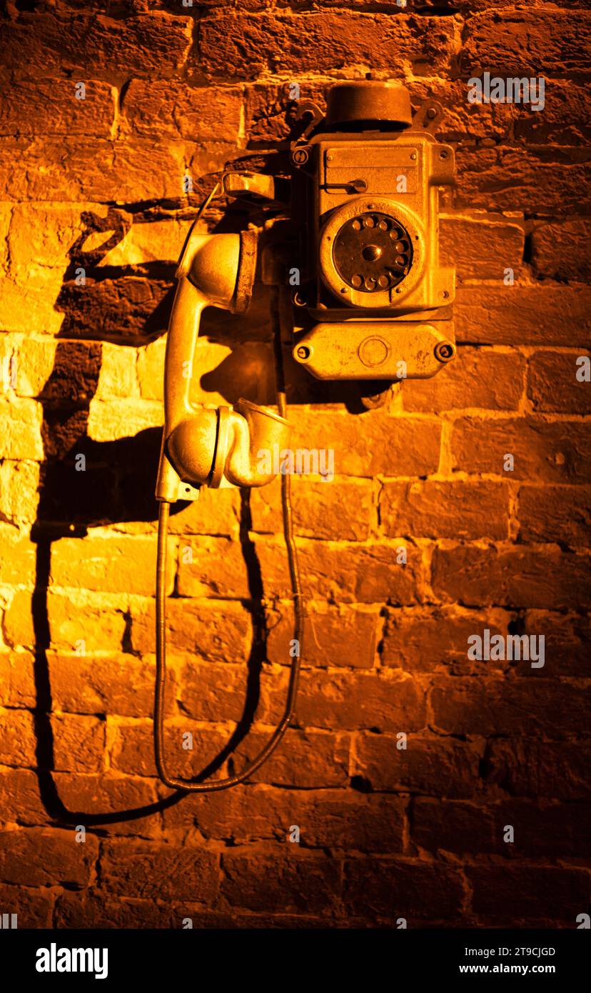 Vintage Connection: Old Telephone Gracing a Brick Wall Stock Photo - Alamy