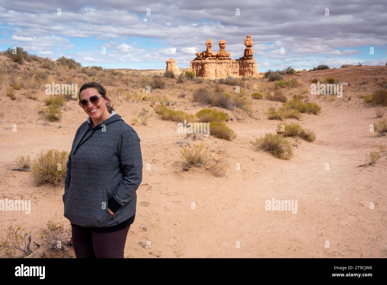 Happy overweight woman walking in the desert Stock Photo - Alamy