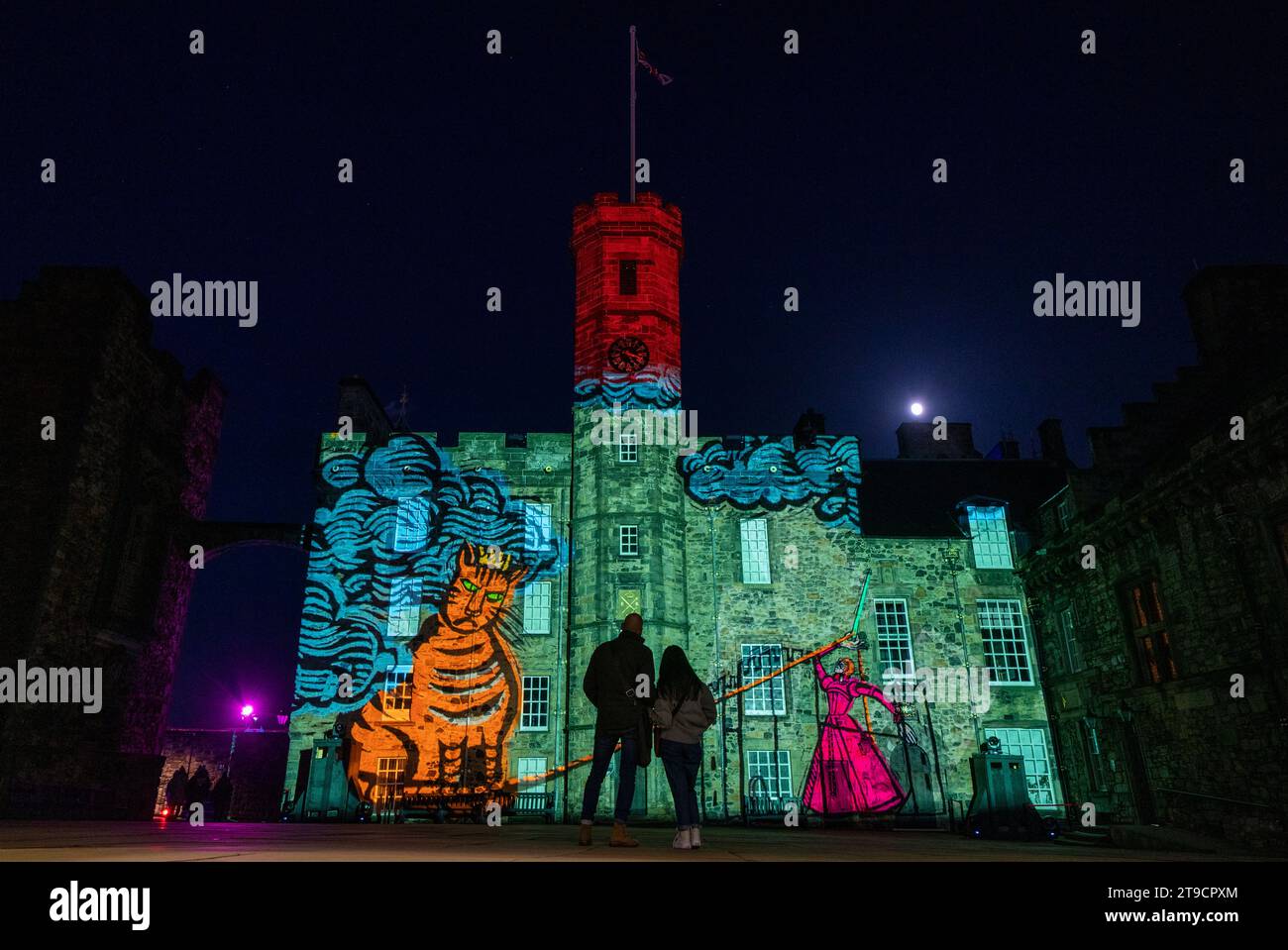 A couple view the projections in Crown Square at the Castle of Light ...