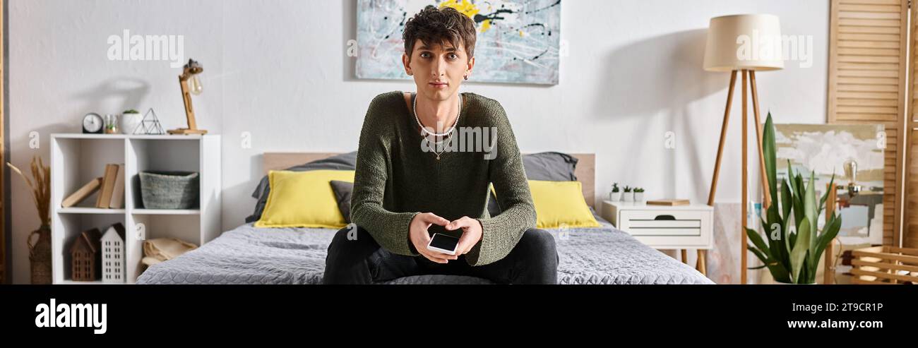 banner of young transgender person in casual attire looking at camera ...