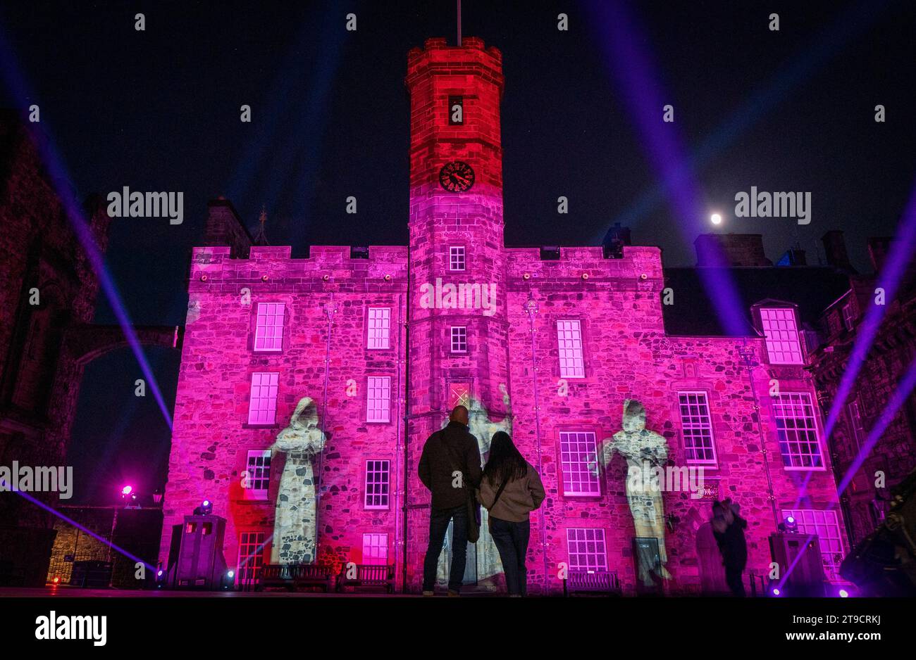 A couple view the projections in Crown Square at the Castle of Light ...