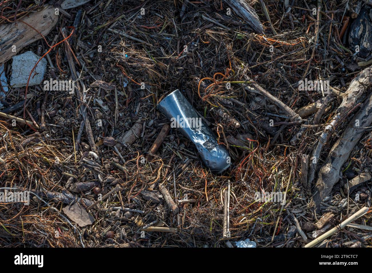Beach in northern Italy after a violent storm. Plastic and cans ...