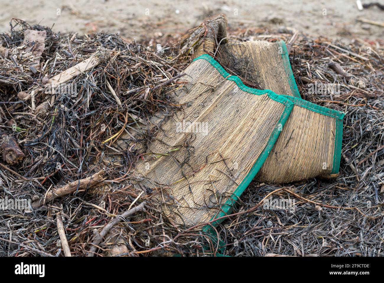 Beach in northern Italy after a violent storm. Plastic and cans ...