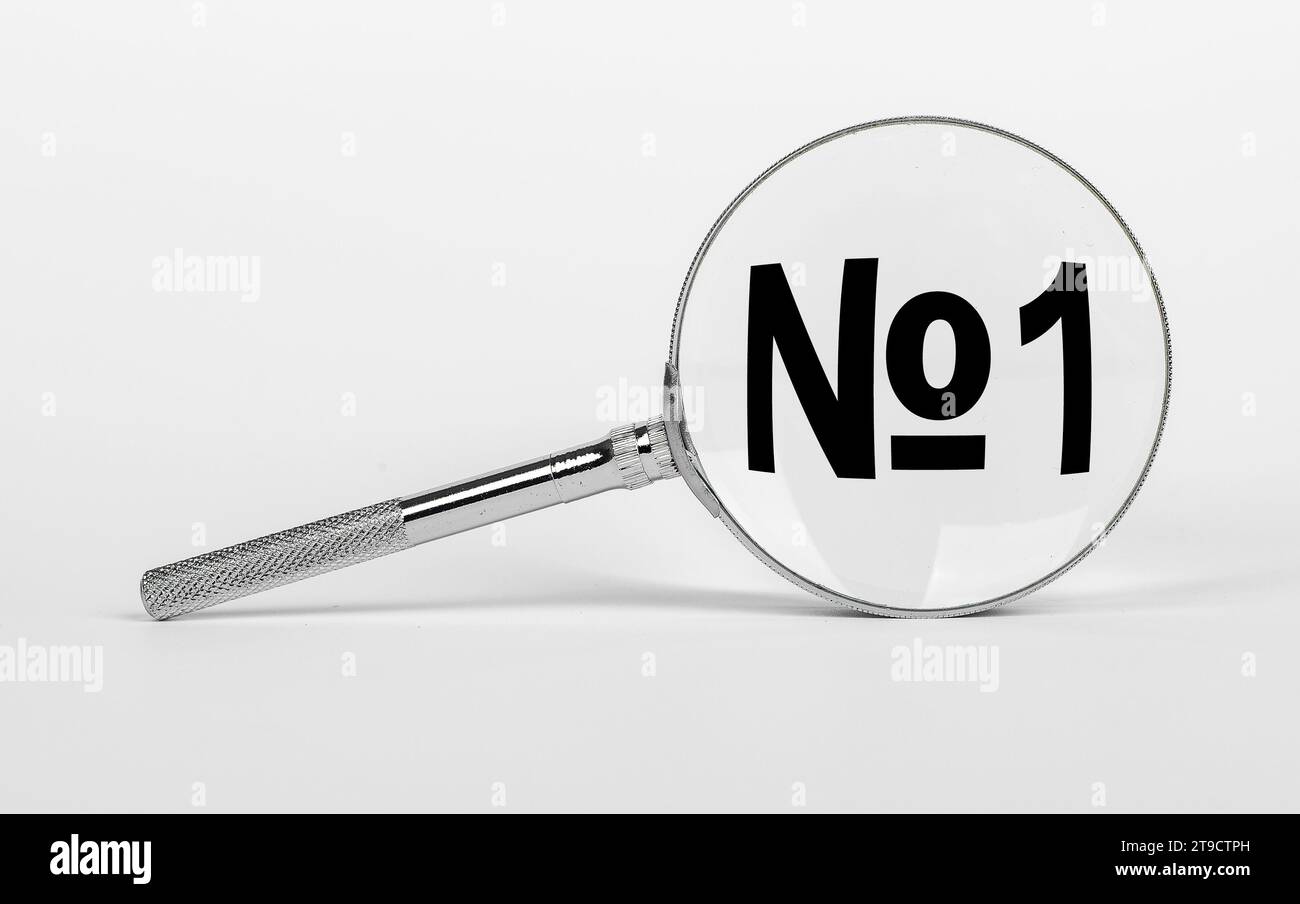 Number one, 1st, first place, winner through magnifier Stock Photo - Alamy