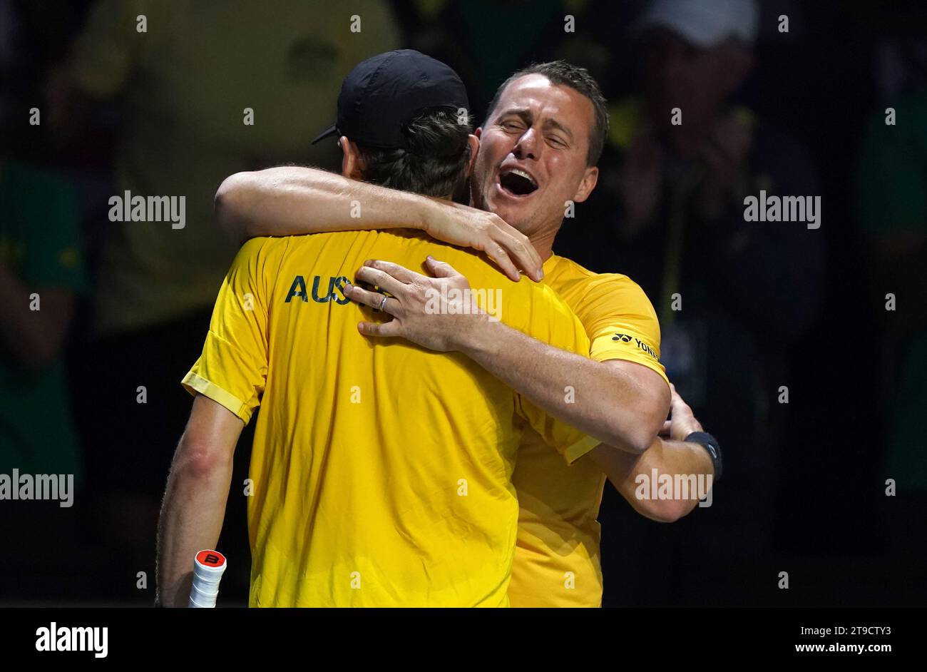 Australia's captain Lleyton Hewitt (right) congratulates Alex de Minaur ...
