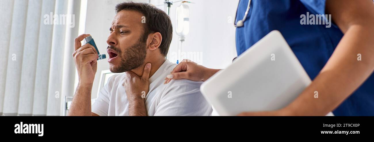 african american nurse helping her indian patient with asthma inhaler ...