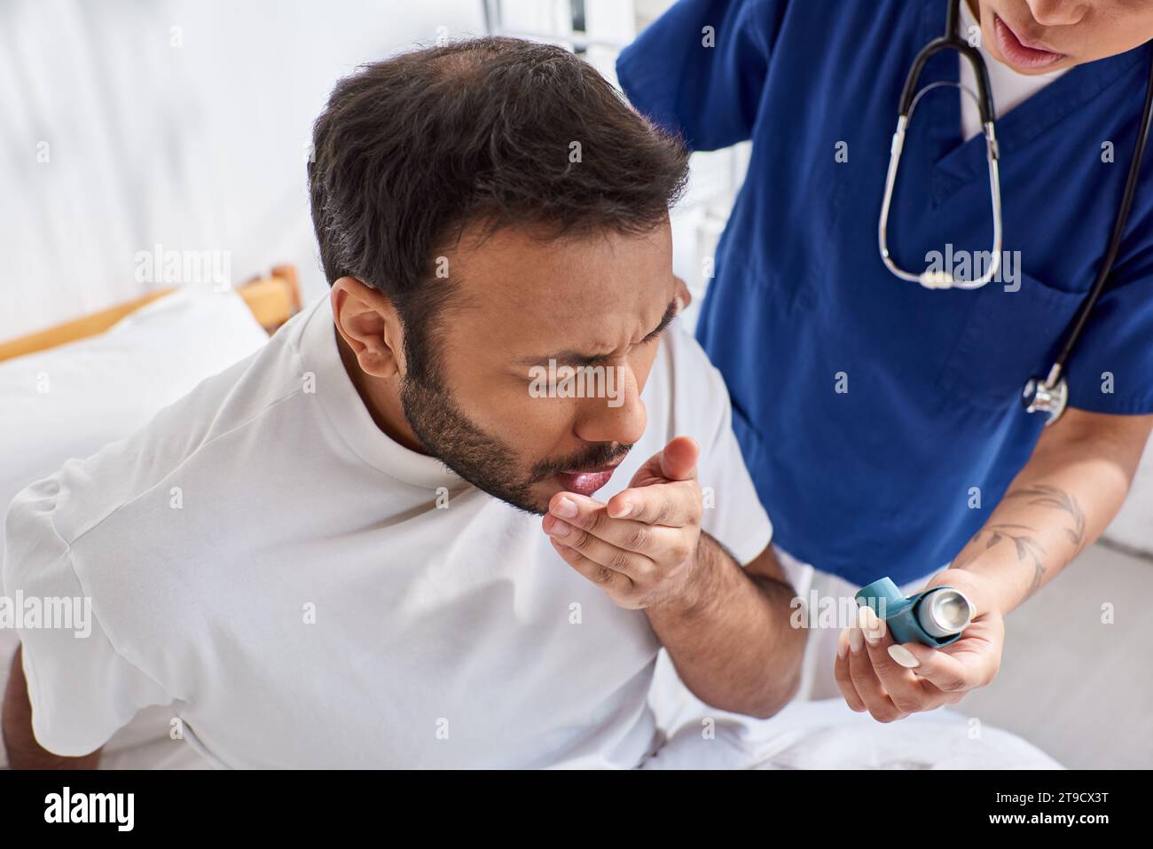 young african american nurse giving asthma inhaler to her ill indian ...