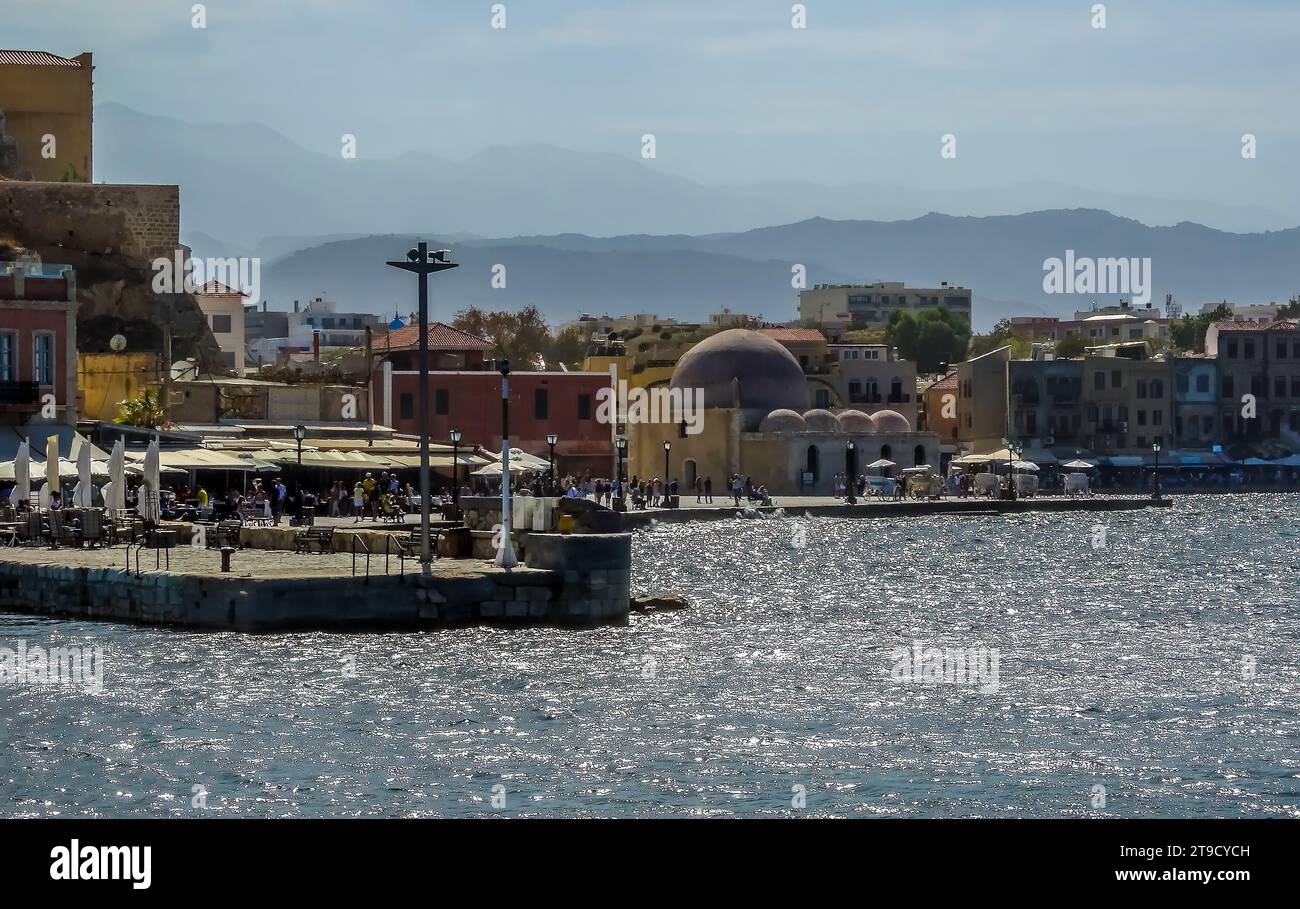 A view of Chania harbour, Crete with the White Mountains in the distant ...