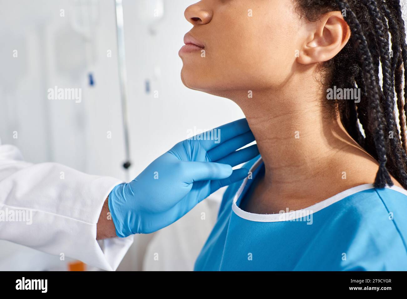 cropped view of sick african american woman when her indian doctor ...