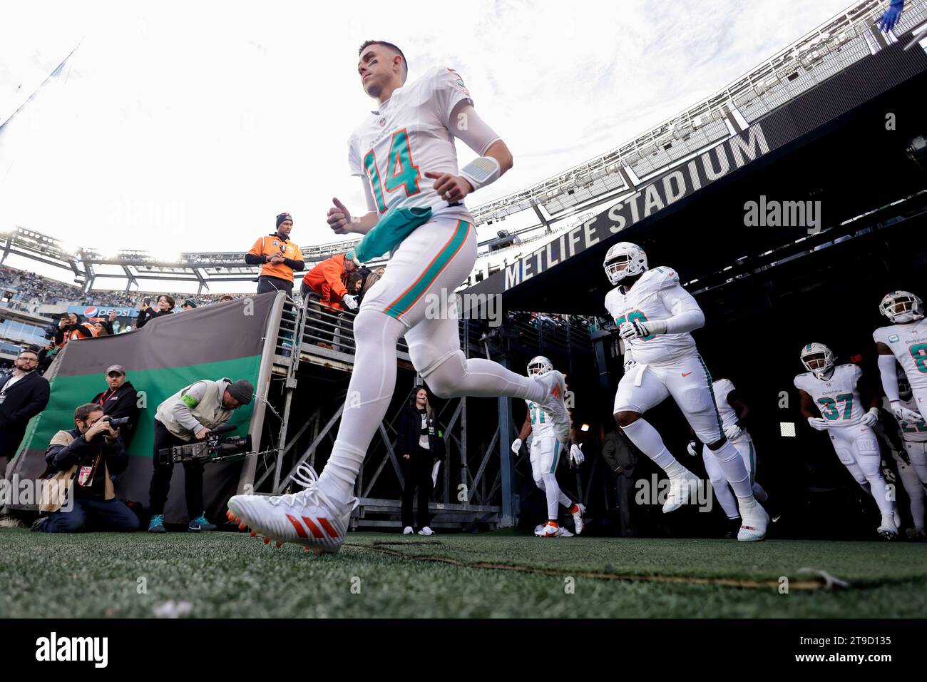 Miami Dolphins quarterback Mike White (14) runs onto the field to play ...
