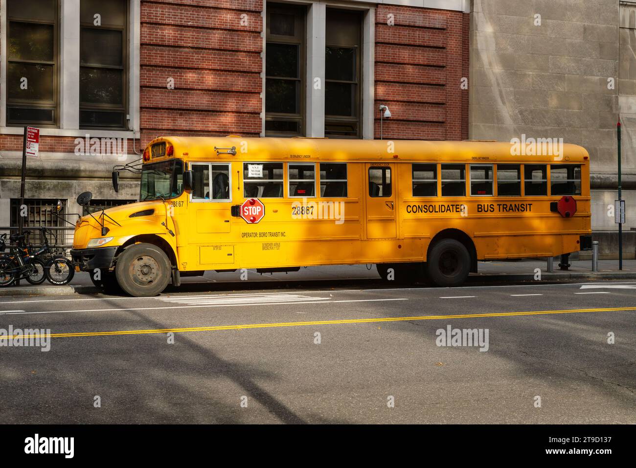 Yellow American school bus near Columbus Circle, Central park West, New ...
