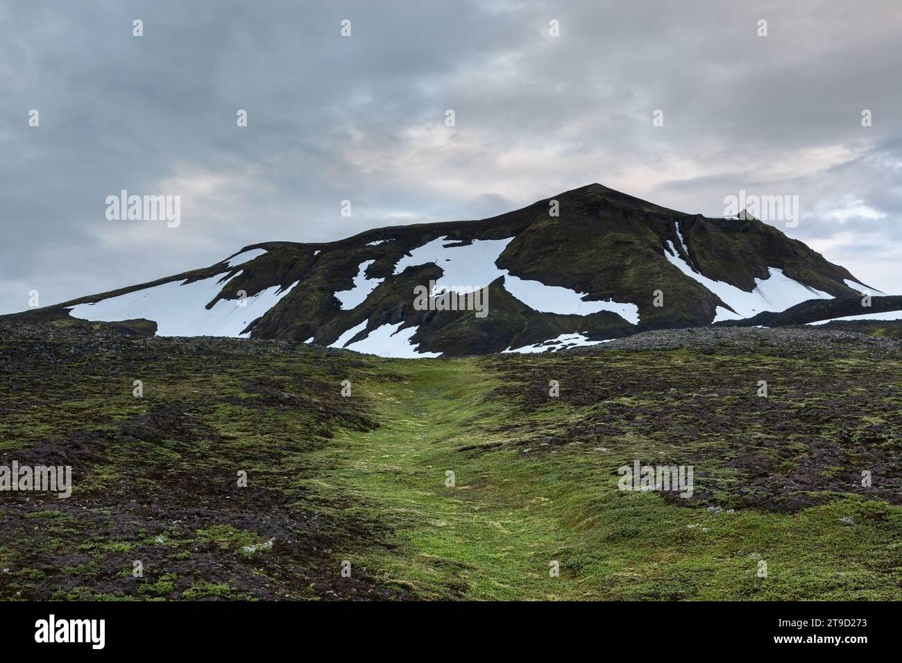 Iceland green hills with snow patches in Snaefellsnes national park ...