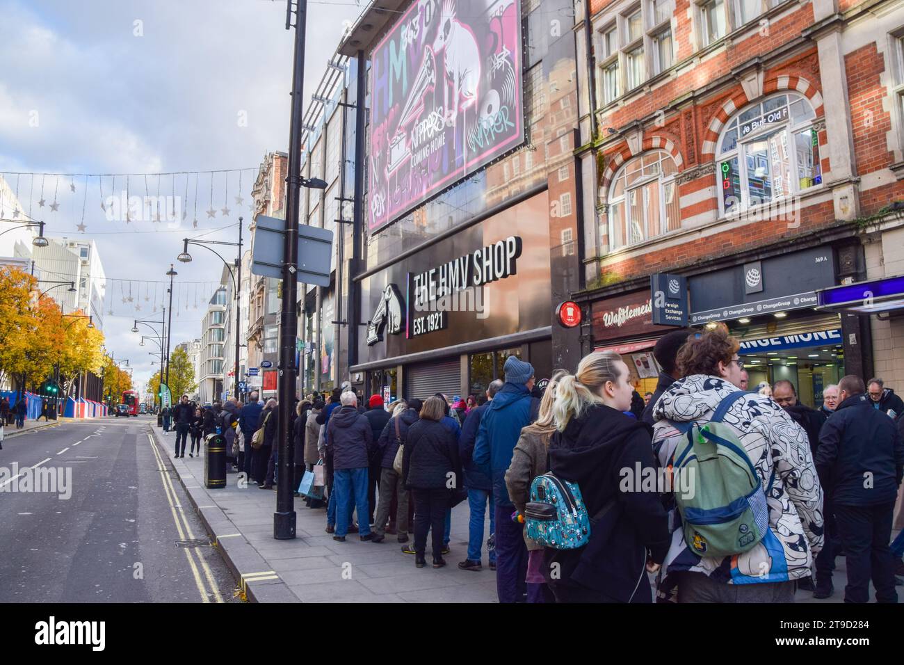 London, UK. 24th Nov, 2023. Fans queue up for the reopening of HMV on ...