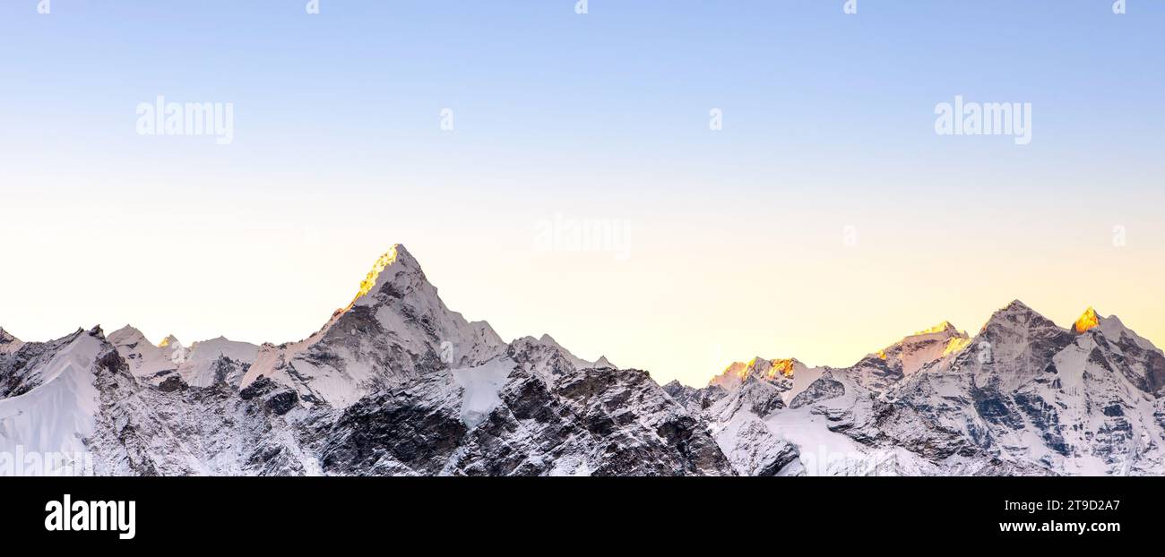 Himalayan mountain range. Banner sized photo with Ama Dablam peak and ...